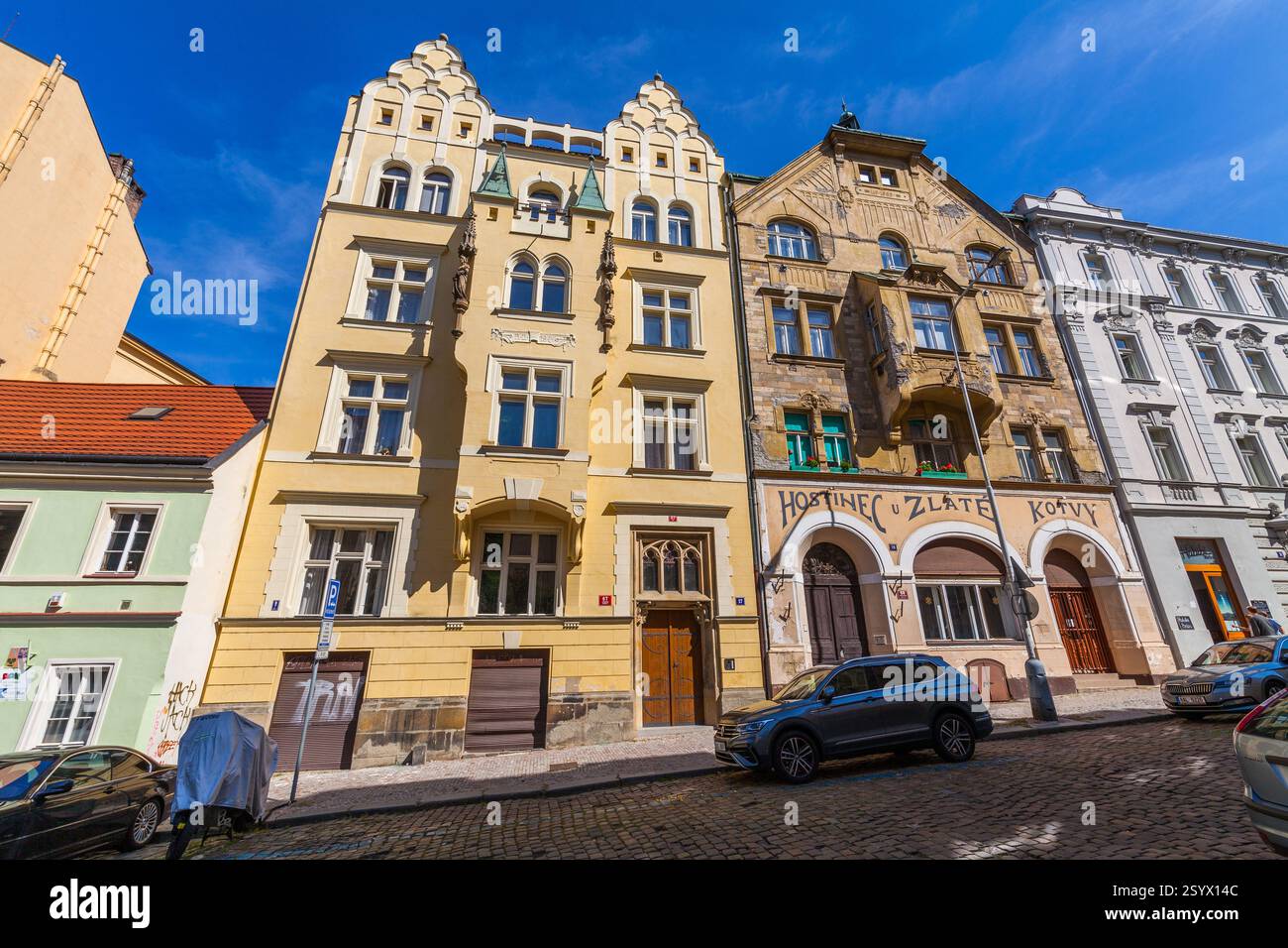 A collection of narrow, colorful buildings with distinct architectural ...