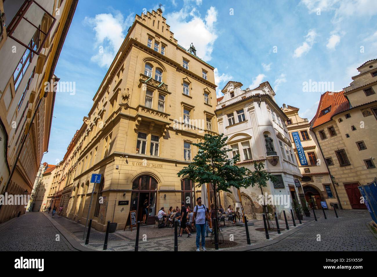 A charming European street scene showcases historic buildings with ...