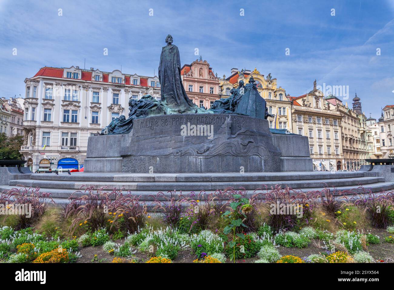 A large, elevated monument featuring a central figure and accompanying ...