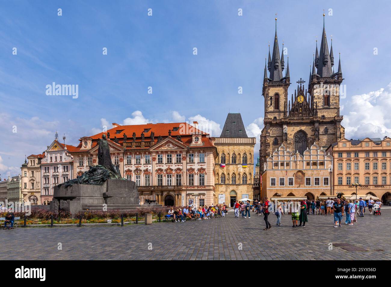 A bustling European square featuring a historic church with striking ...