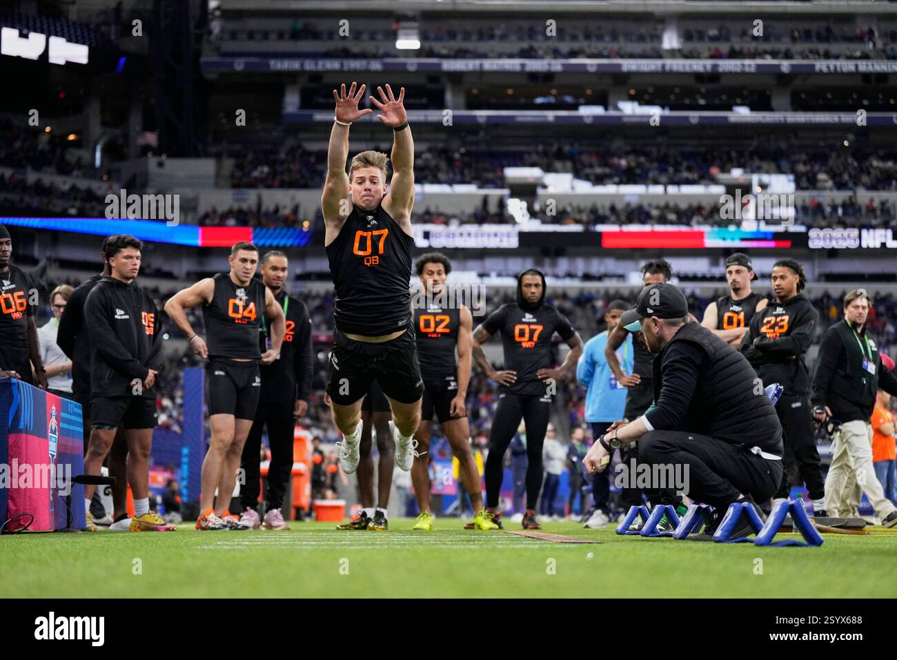 Ohio State quarterback Will Howard runs a drill at the NFL football ...