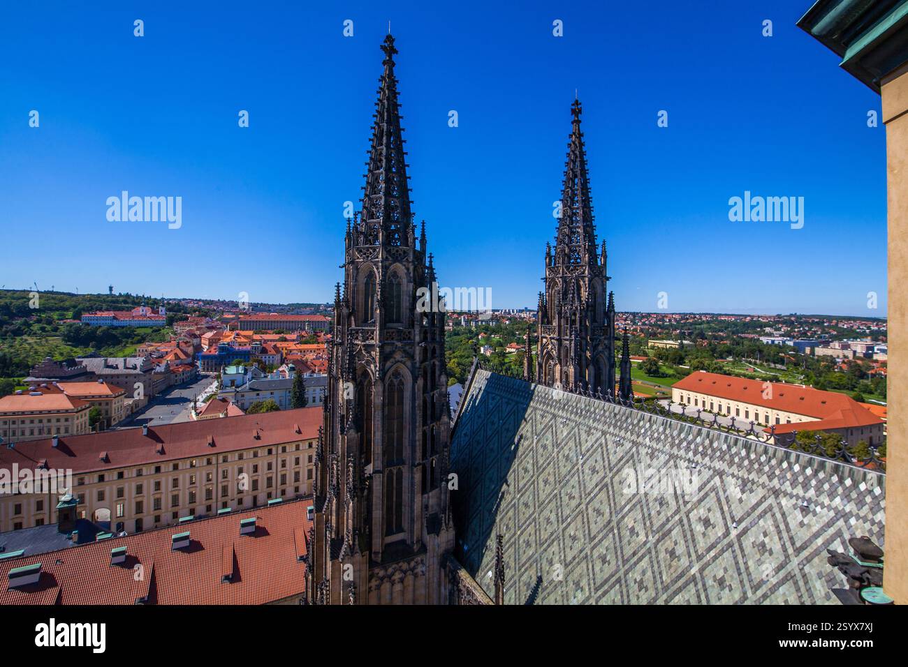 A high-angle shot showcasing the spires of a gothic cathedral rising ...