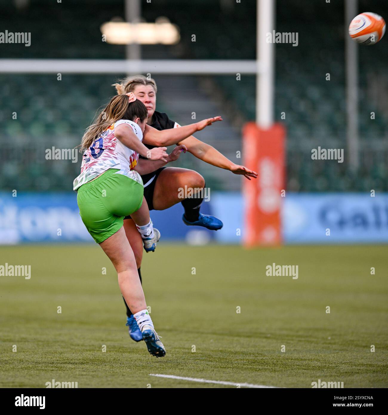 Kayleigh Powell of Harlequins Women kicks to clear as May Campbell of ...