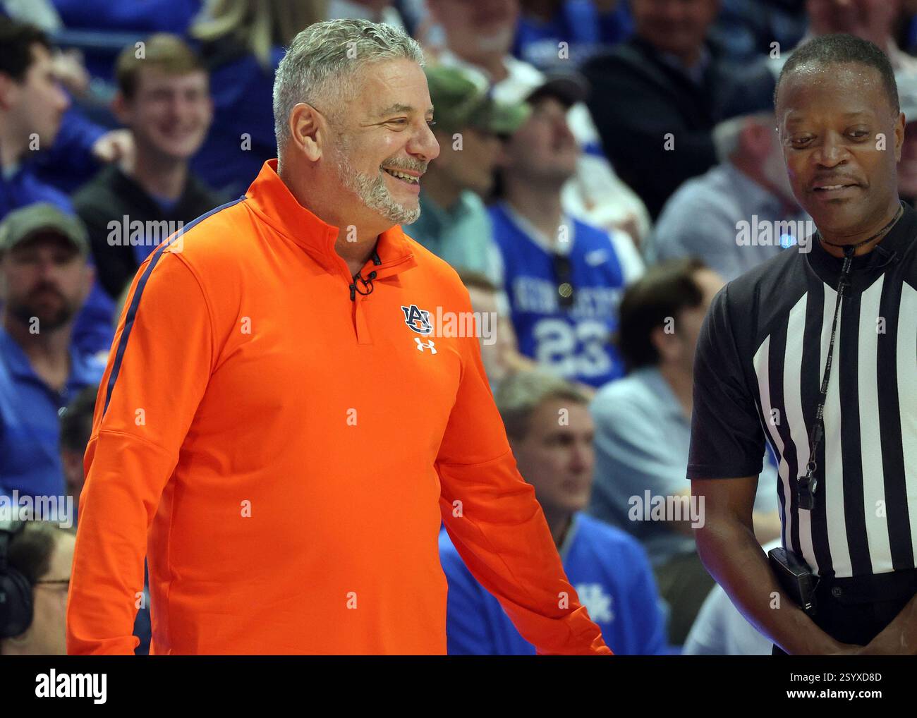 Auburn head coach Bruce Pearl, left, enjoys a lighter moment with ...