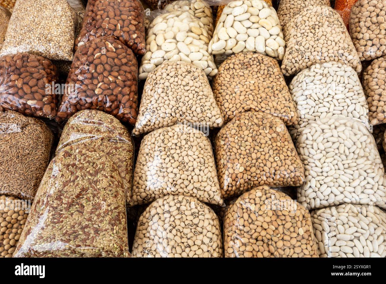 Various types of beans and others grains packaged and sold at a ...