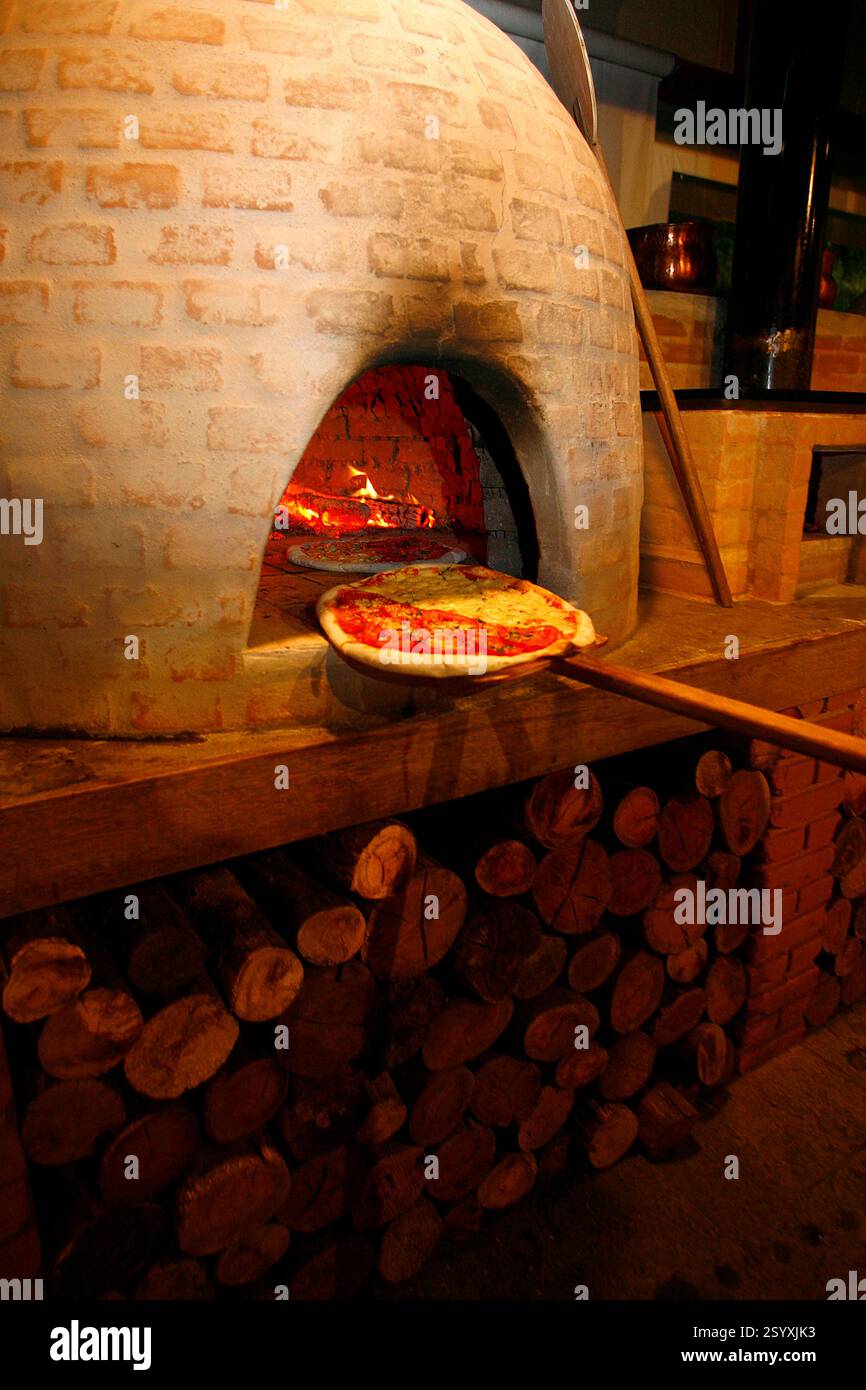 Traditional Italian pizza woodfired stone oven Stock Photo - Alamy