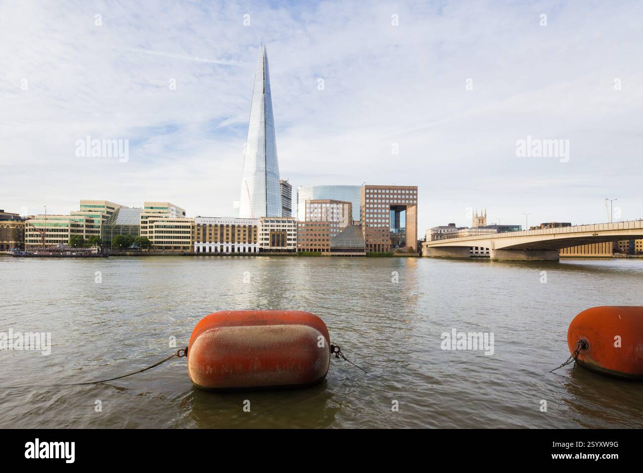 London, UK. View of the Shard, buildings along the River Thames, and ...