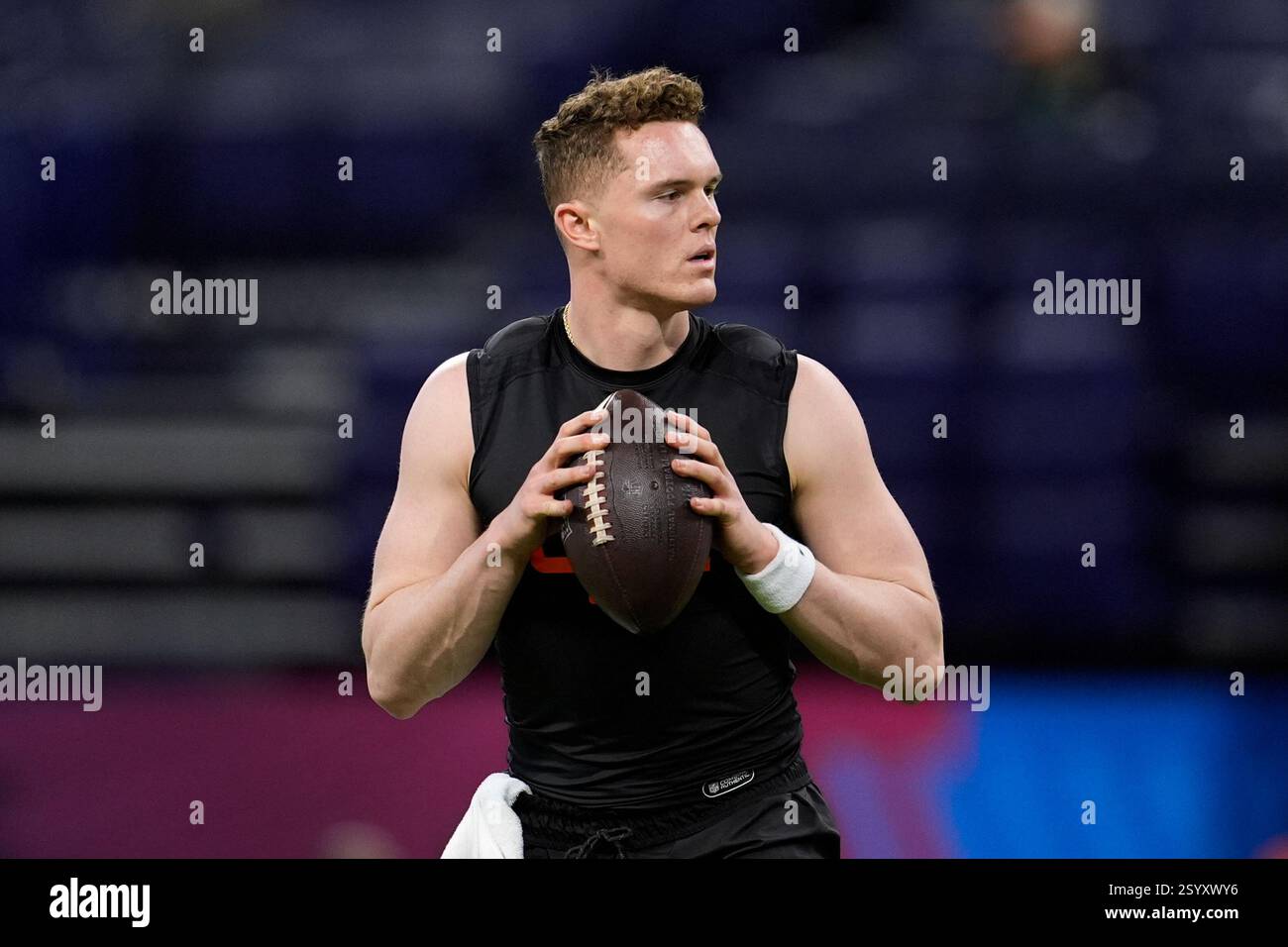 Missouri quarterback Brady Cook warms up at the NFL football scouting ...