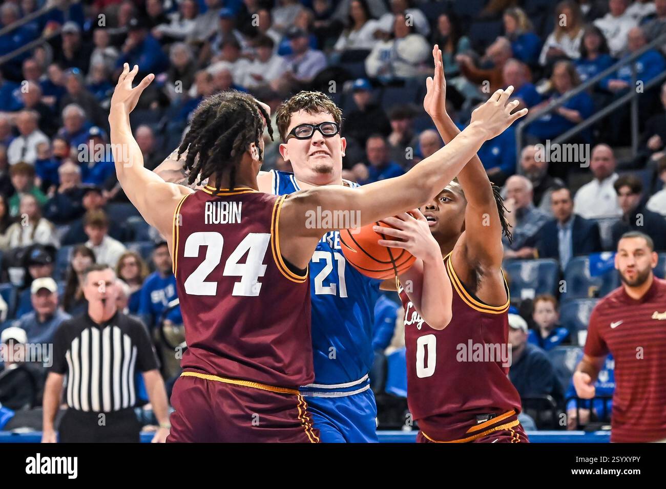 MARCH 01, 2025: The double team defense of Loyola (Il) Ramblers center ...