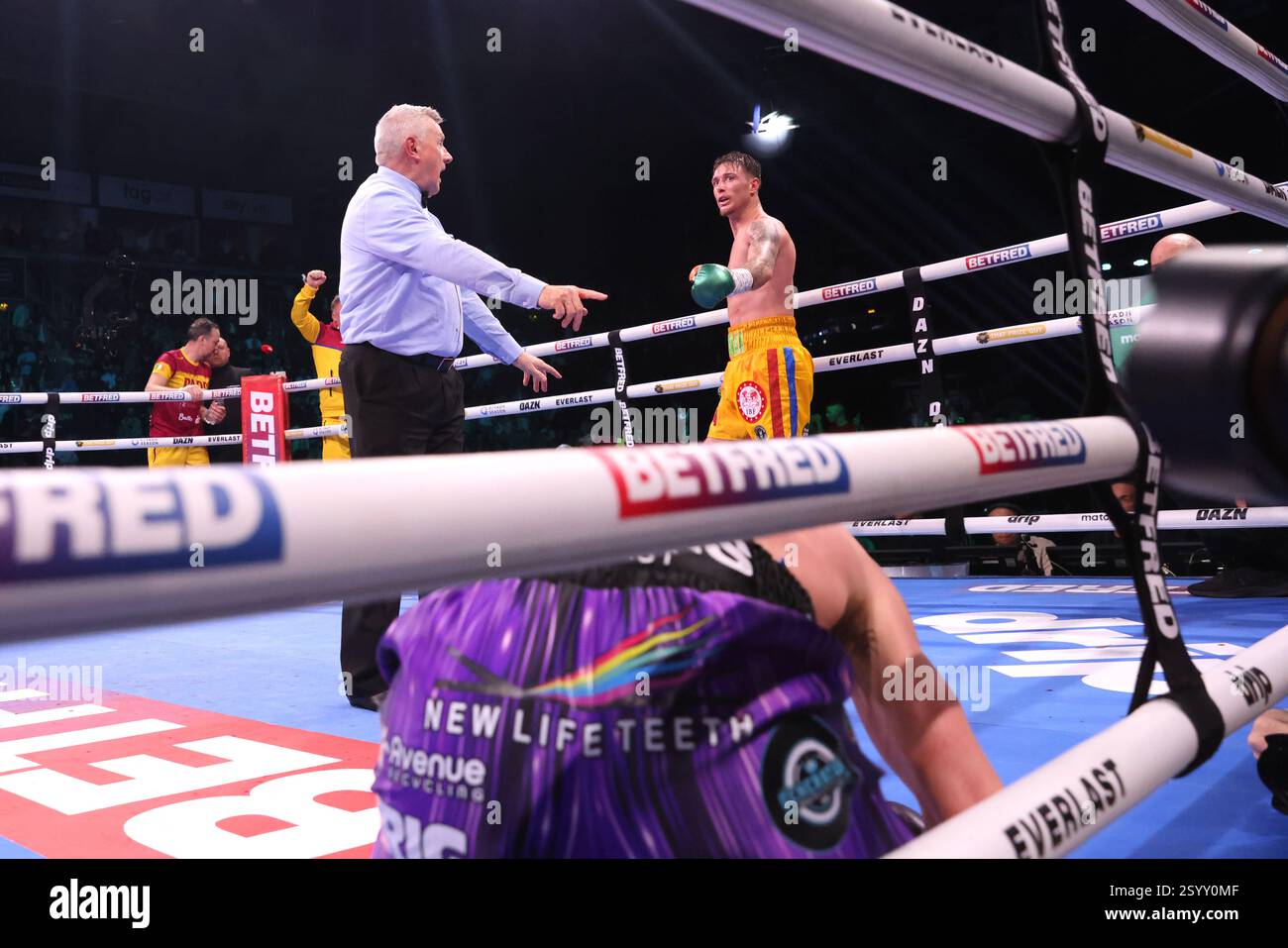 Referee Marcus McDonnell (left) disqualifies Paddy Donovan for a late ...