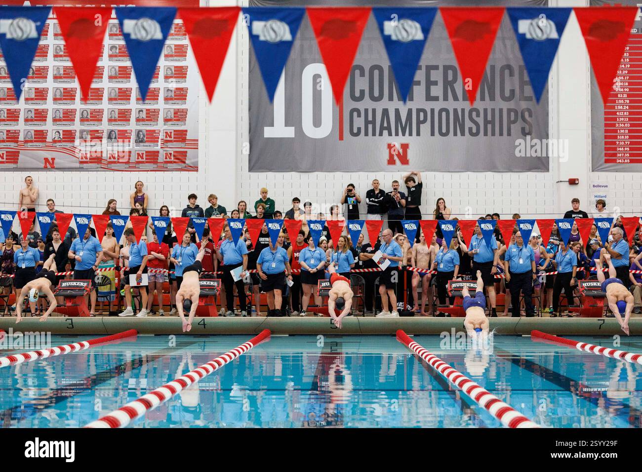 Swimmers compete in the boys 100-yard butterfly during the Nebraska ...