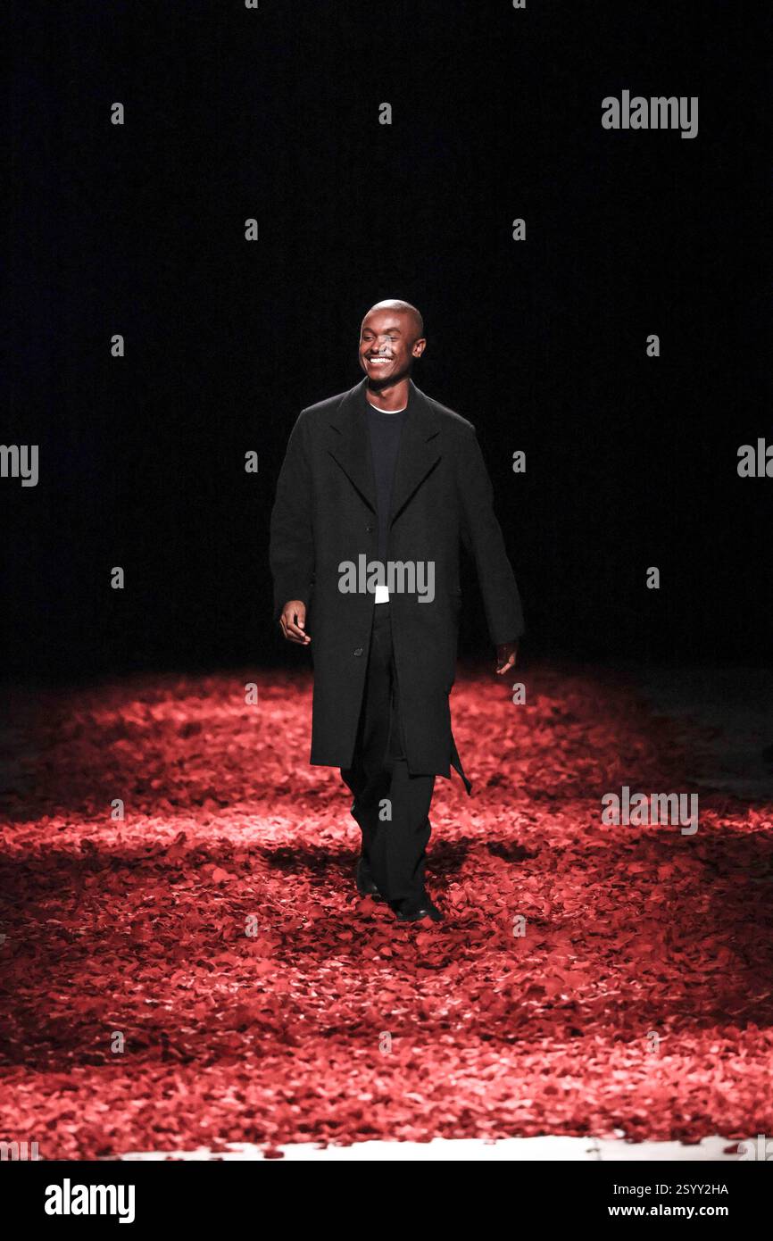 Designer Maximilian Davis walks on the runway during the Versace Ready ...