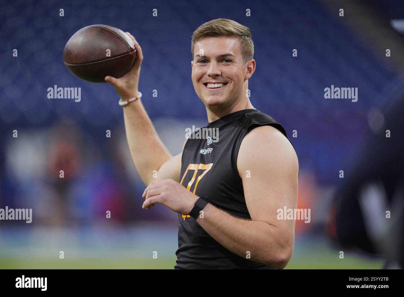 Ohio State quarterback Will Howard smiles as he warms up at the NFL ...