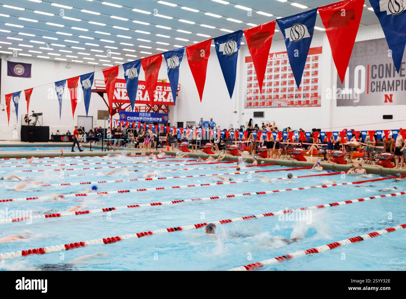Swimmers warm up during the Nebraska state swimming championships in ...