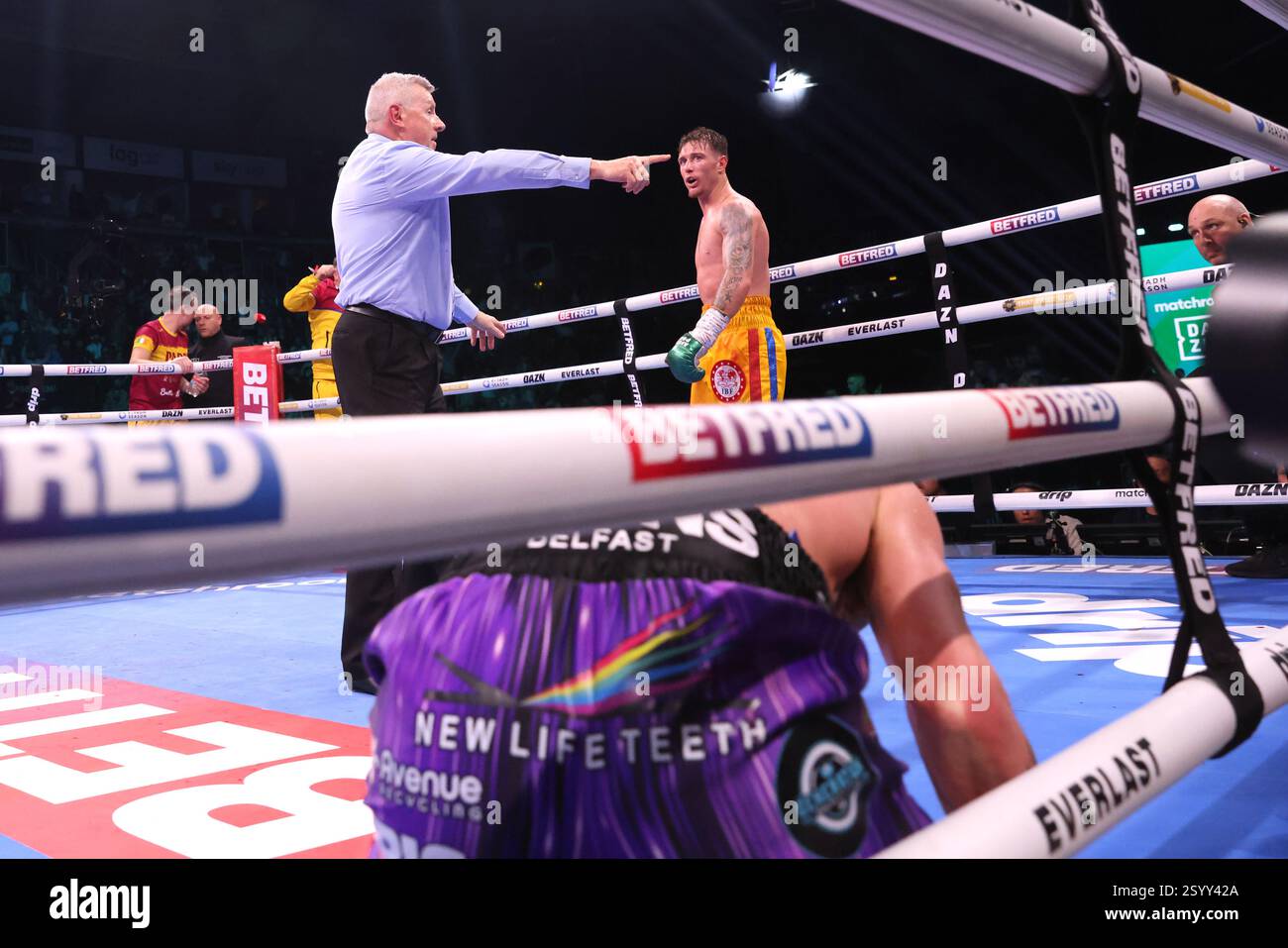 Referee Marcus McDonnell (left) disqualifies Paddy Donovan for a late ...