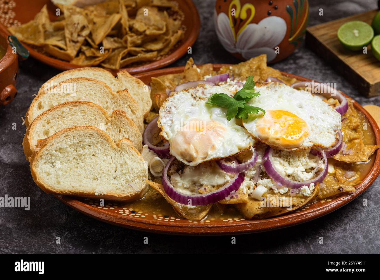 Delicious Mexican Chilaquiles with Eggs and Bread Stock Photo - Alamy