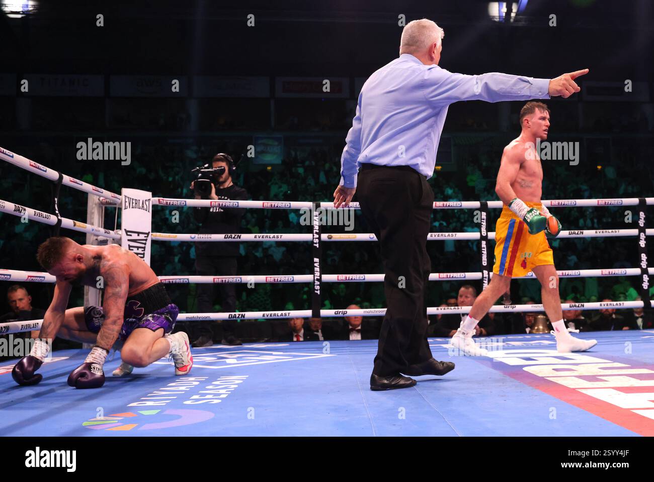 Lewis Crocker (left) reacts after being struck by Paddy Donovan (right ...