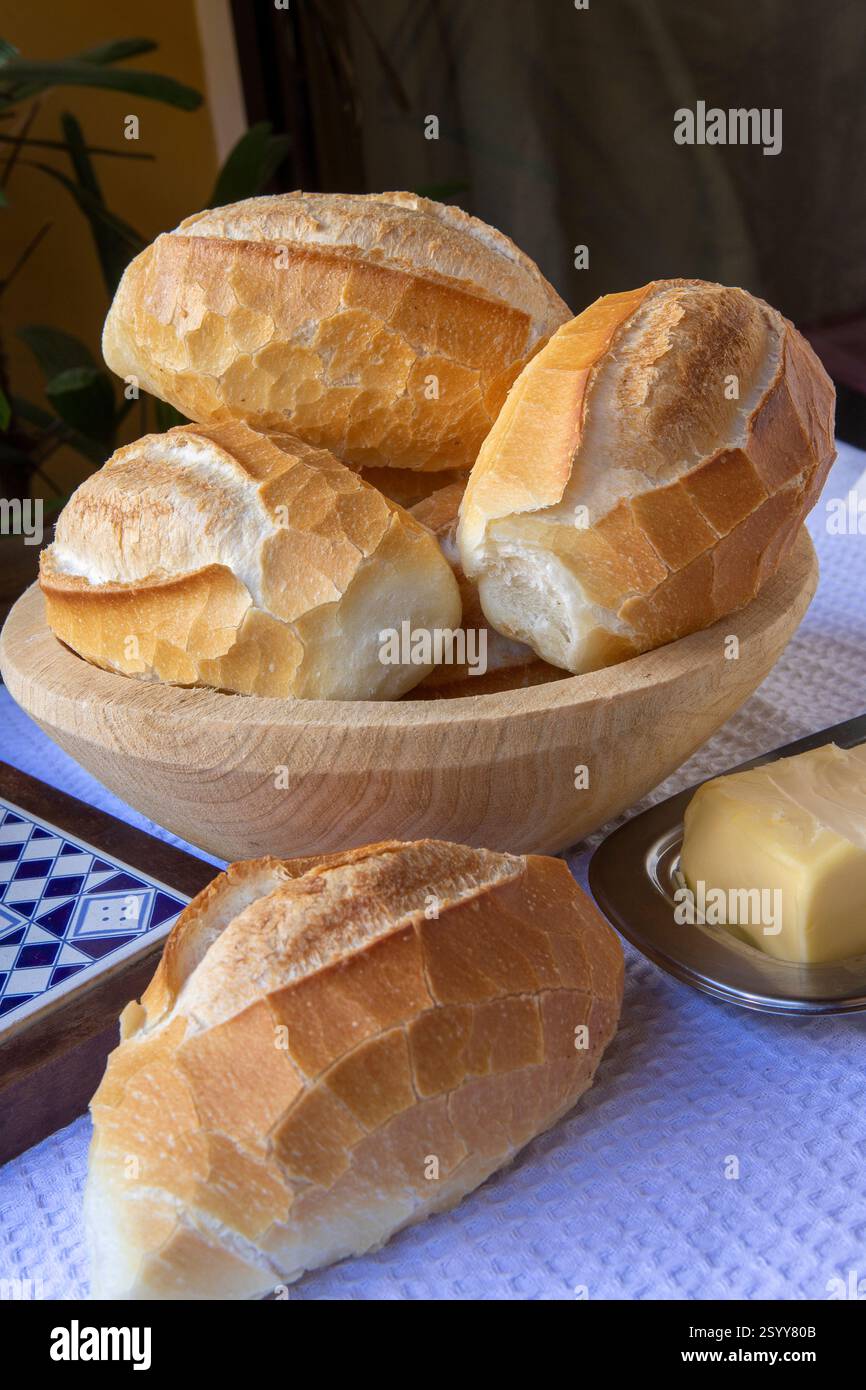 Basket of French bread, traditional Brazilian bread, with butter for ...