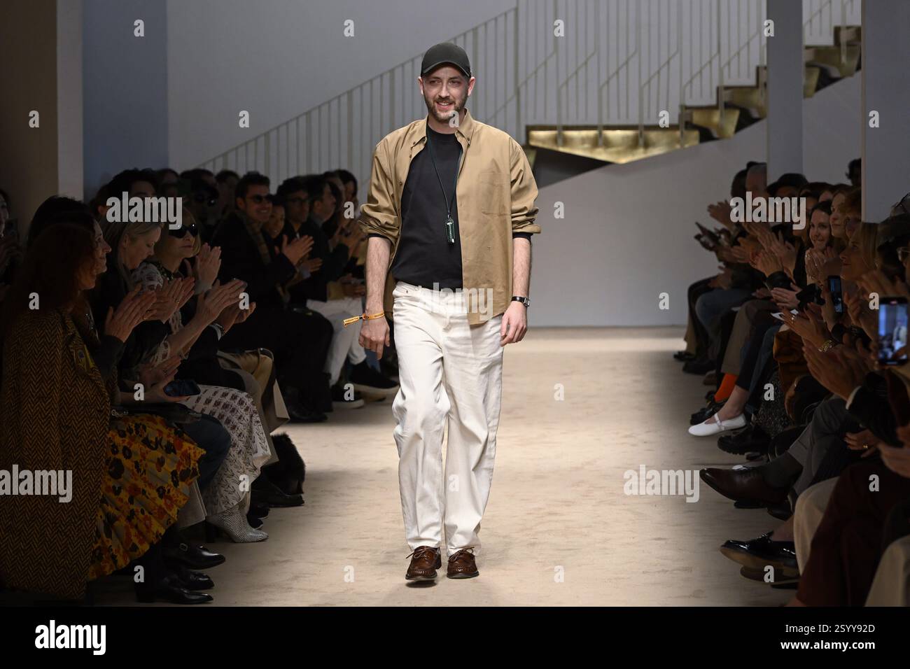 Designer Matteo Tamburini walks on the runway during the Tods Ready to ...