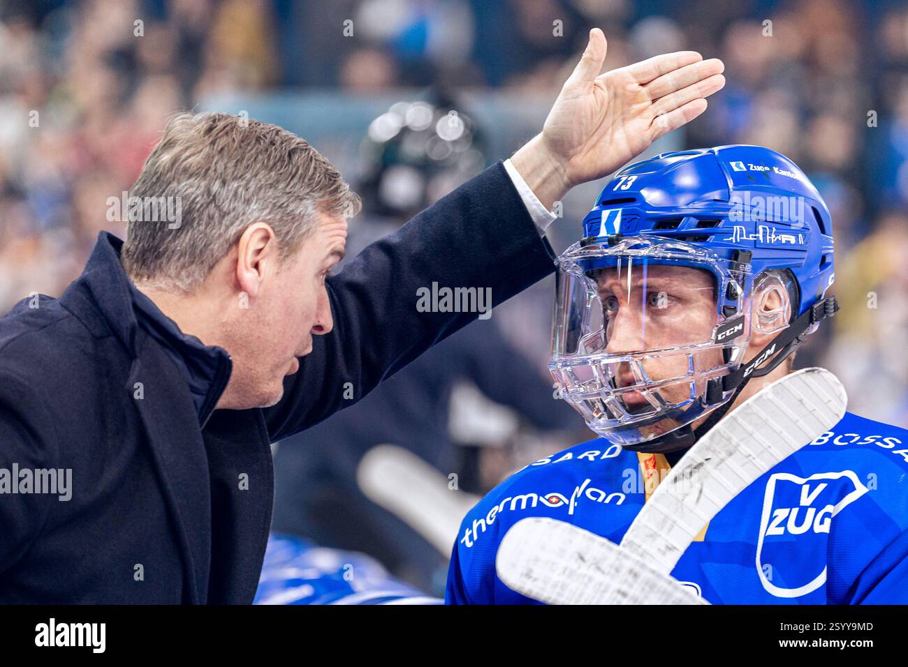 Head Coach Dan Tangnes (EV Zug) gives instructions to Mike Kunzle #73 ...
