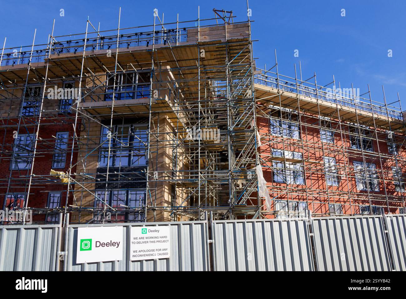 Construction site of flats, apartments with scaffolding on a building ...