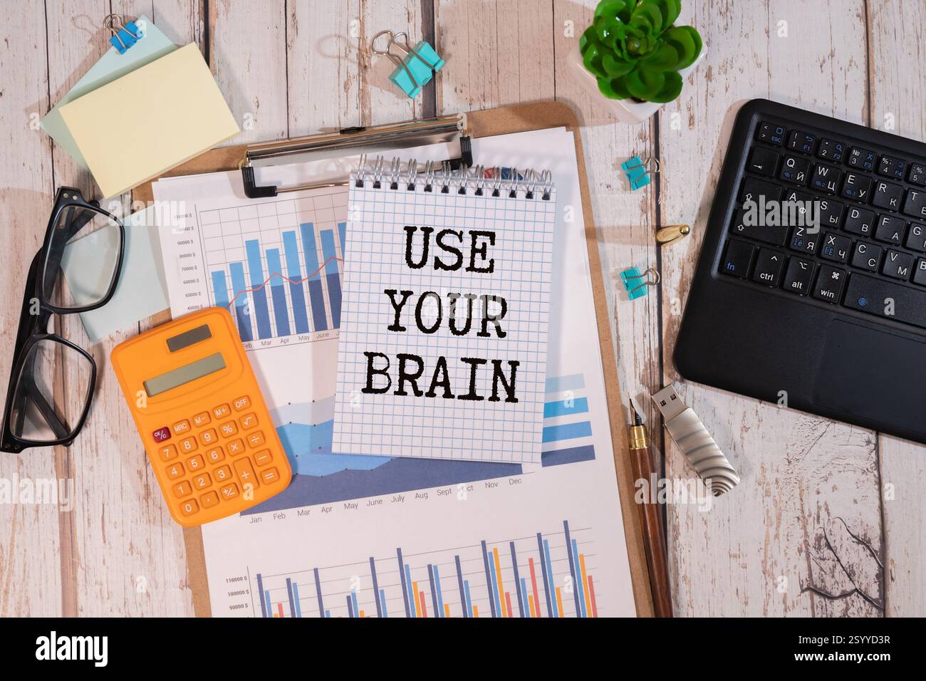 The phrase Use Your Brain in blue text on an index card pinned to a ...