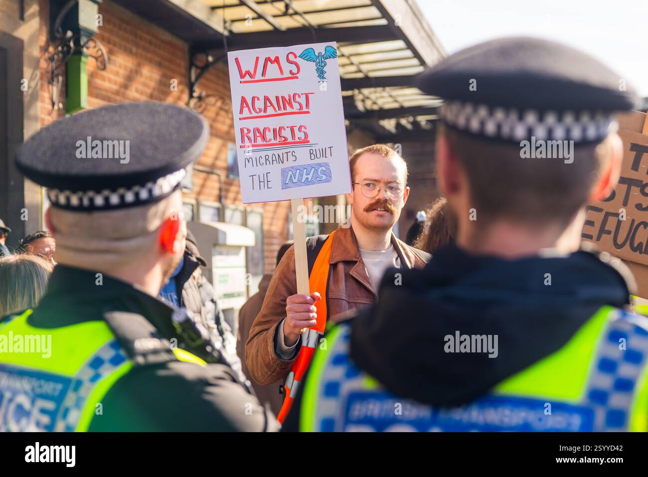 Nuneaton, UK. 01 MAR, 2025. "WMS against Racists" sign held by counter ...