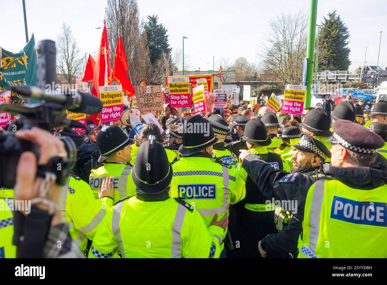 Nuneaton, UK. 01 MAR, 2025. Police grapple with counter protestors as ...