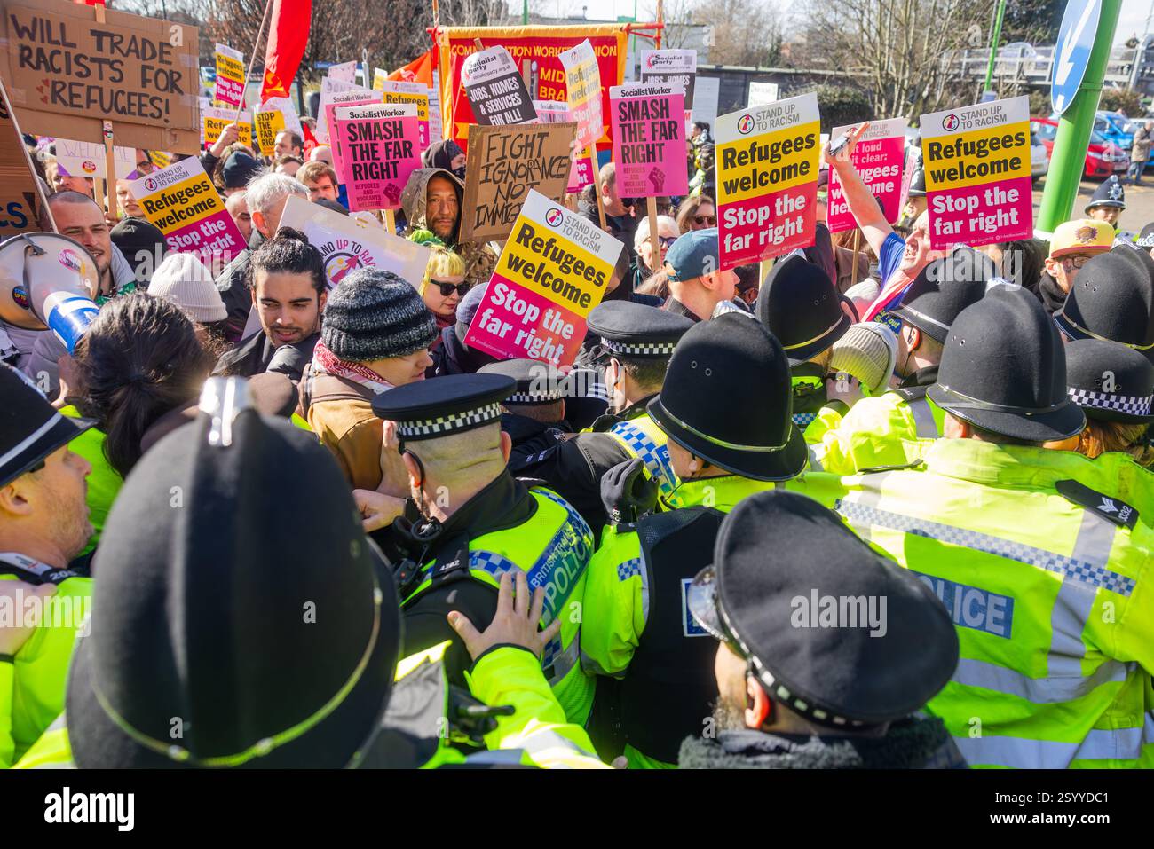 Nuneaton, UK. 01 MAR, 2025. Police grapple with counter protestors as ...
