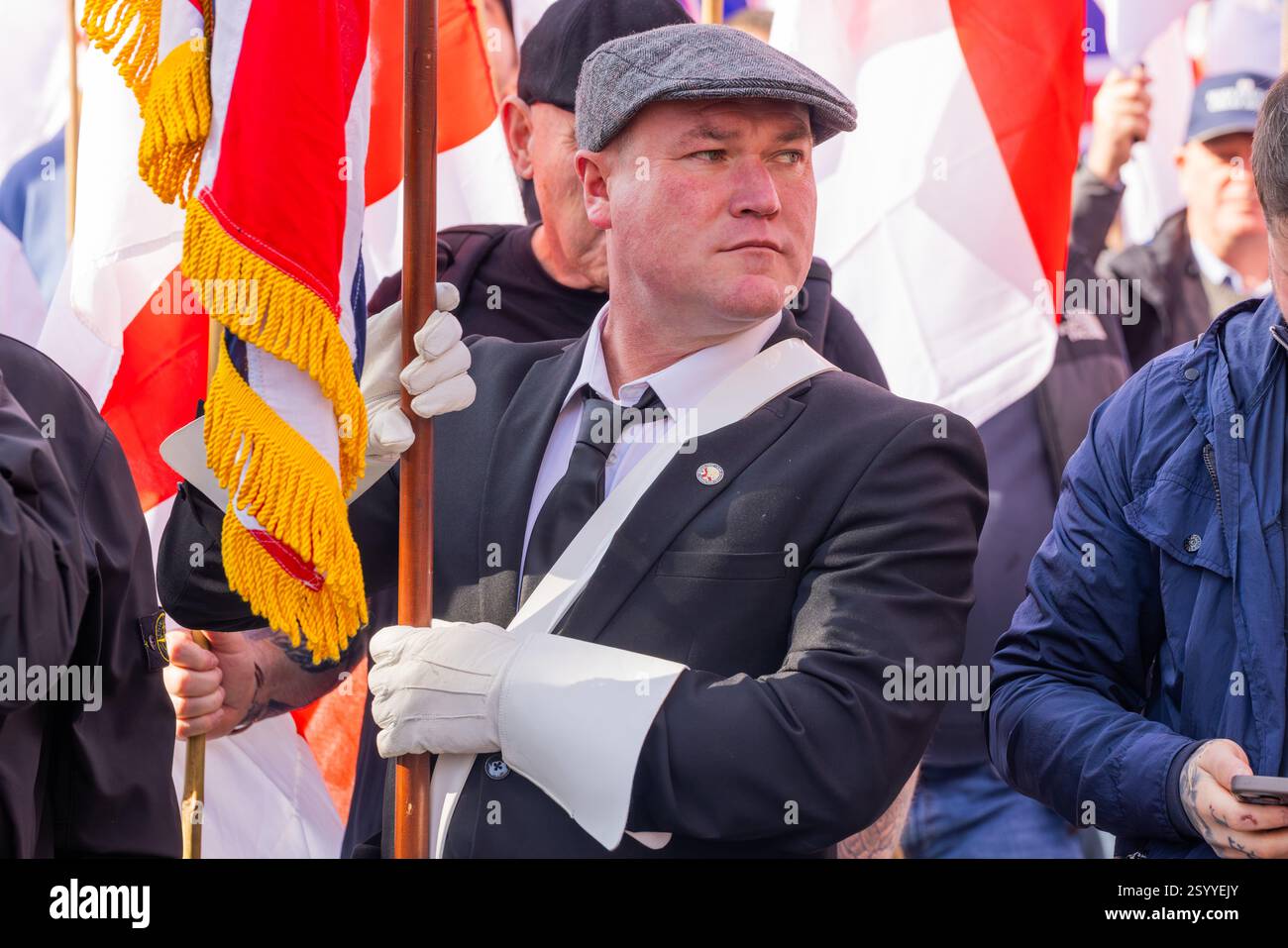 Nuneaton, UK. 01 MAR, 2025. Standard barer carries Union Jack as ...