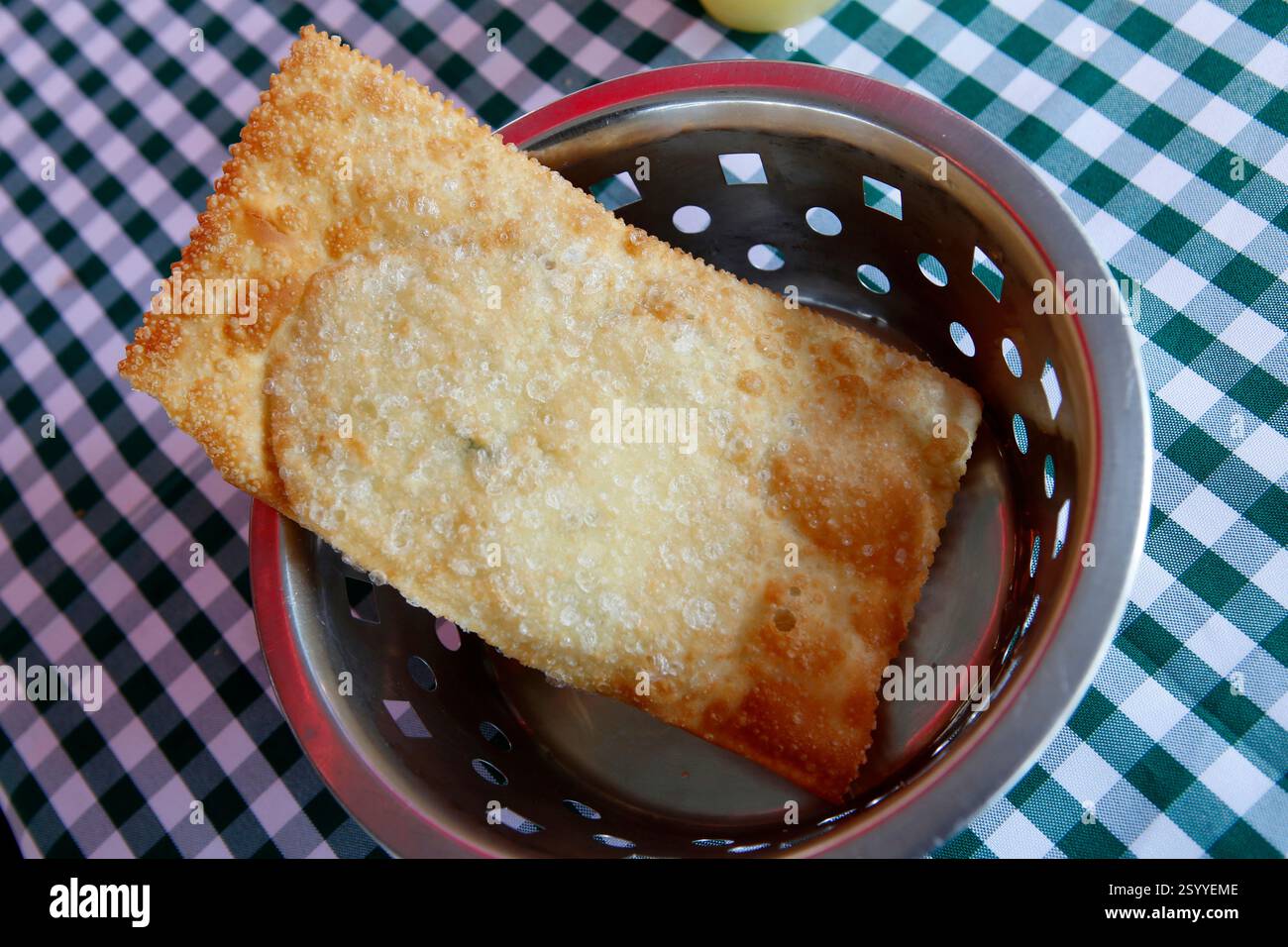 Traditional pastry called pastel in portuguese sold on street market in ...