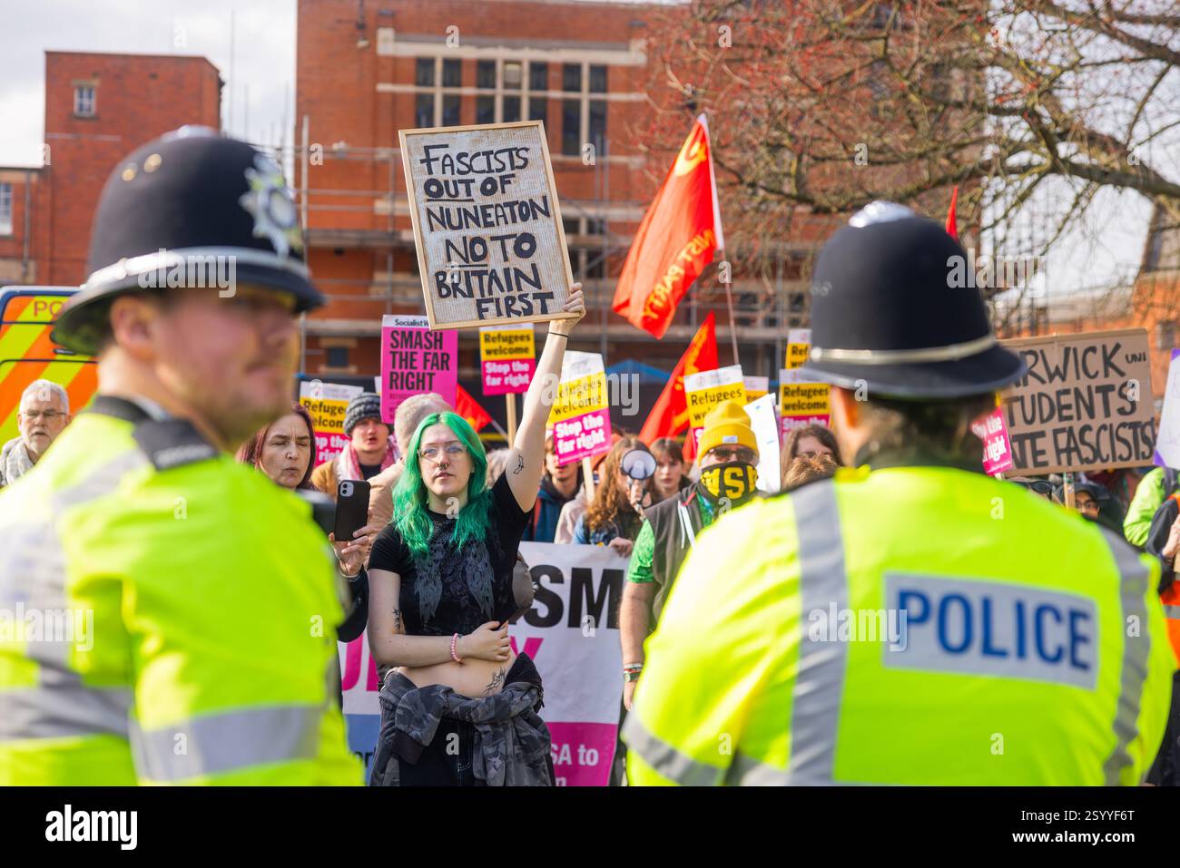 Nuneaton, UK. 01 MAR, 2025. Counter protestor holds "Fascists out of ...