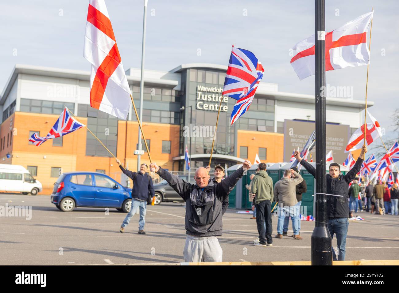 Nuneaton, UK. 01 MAR, 2025. Men pose with English flags as Britain ...