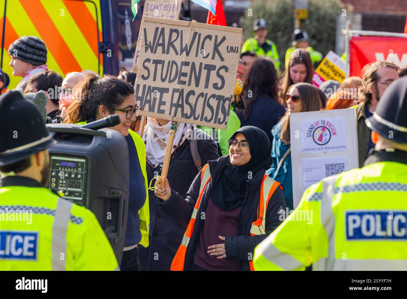 Nuneaton, UK. 01 MAR, 2025. Counter protestor holds "Warwick students ...