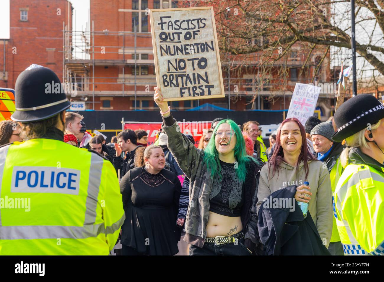 Nuneaton, UK. 01 MAR, 2025. Counter protestor holds "Fascists out of ...
