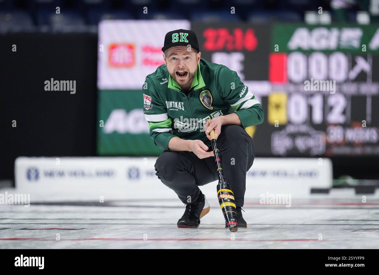 Saskatchewan-McEwen skip Mike McEwen calls to the sweepers while ...