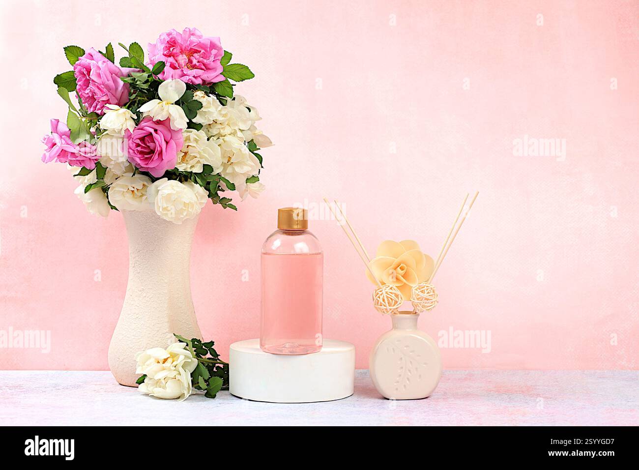 Spa and wellness composition with aromatic rose water and rose flowers ...