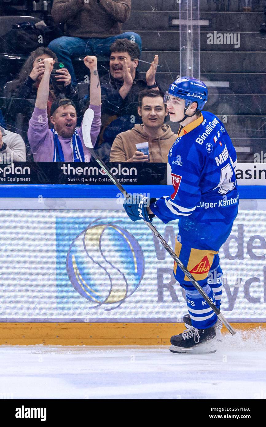 Goal scorer Leon Muggli #41 (EV Zug) is cheered by the Zug fans after ...