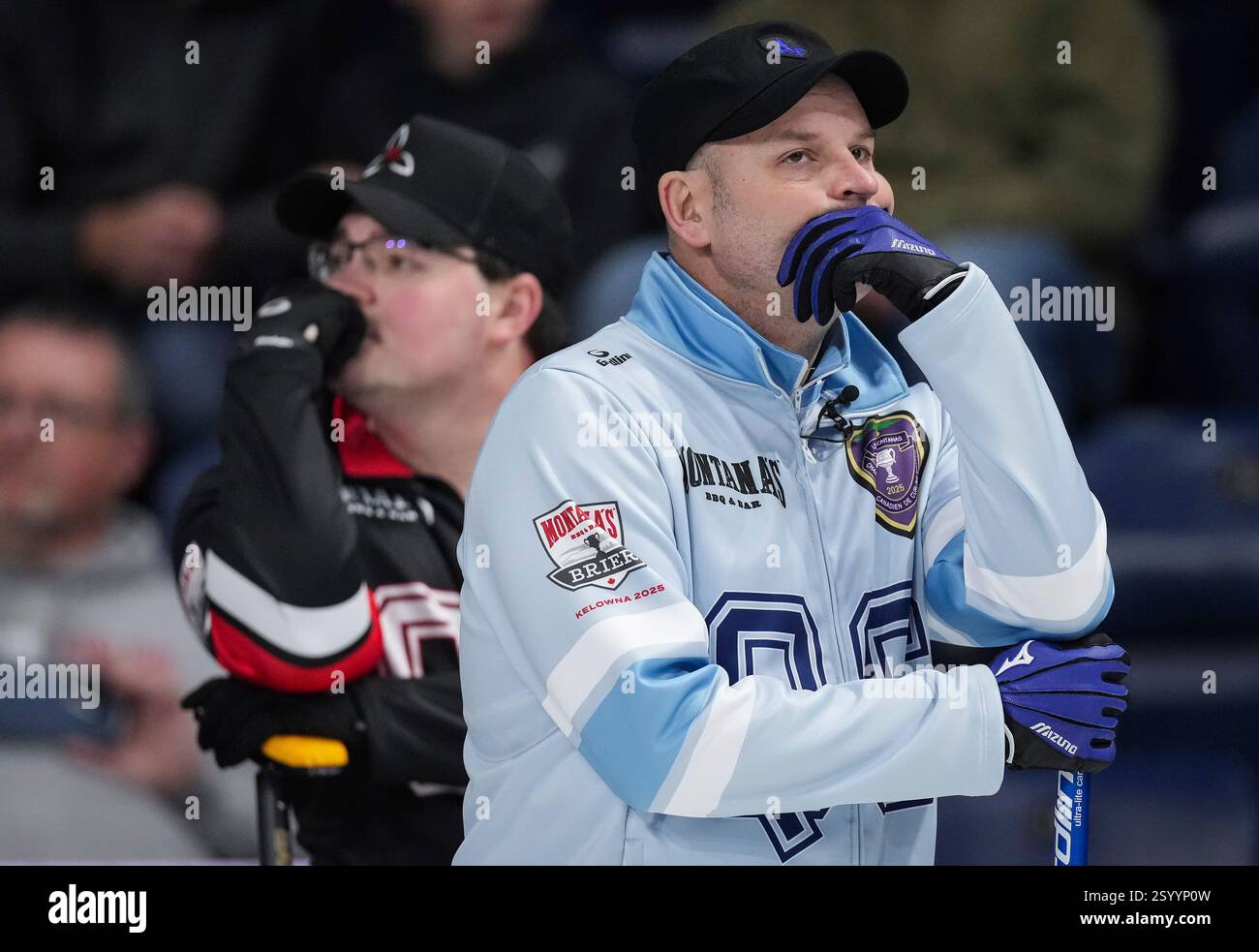 Quebec third Jean-Michel Menard, right, and Ontario skip Sam Mooibroek ...
