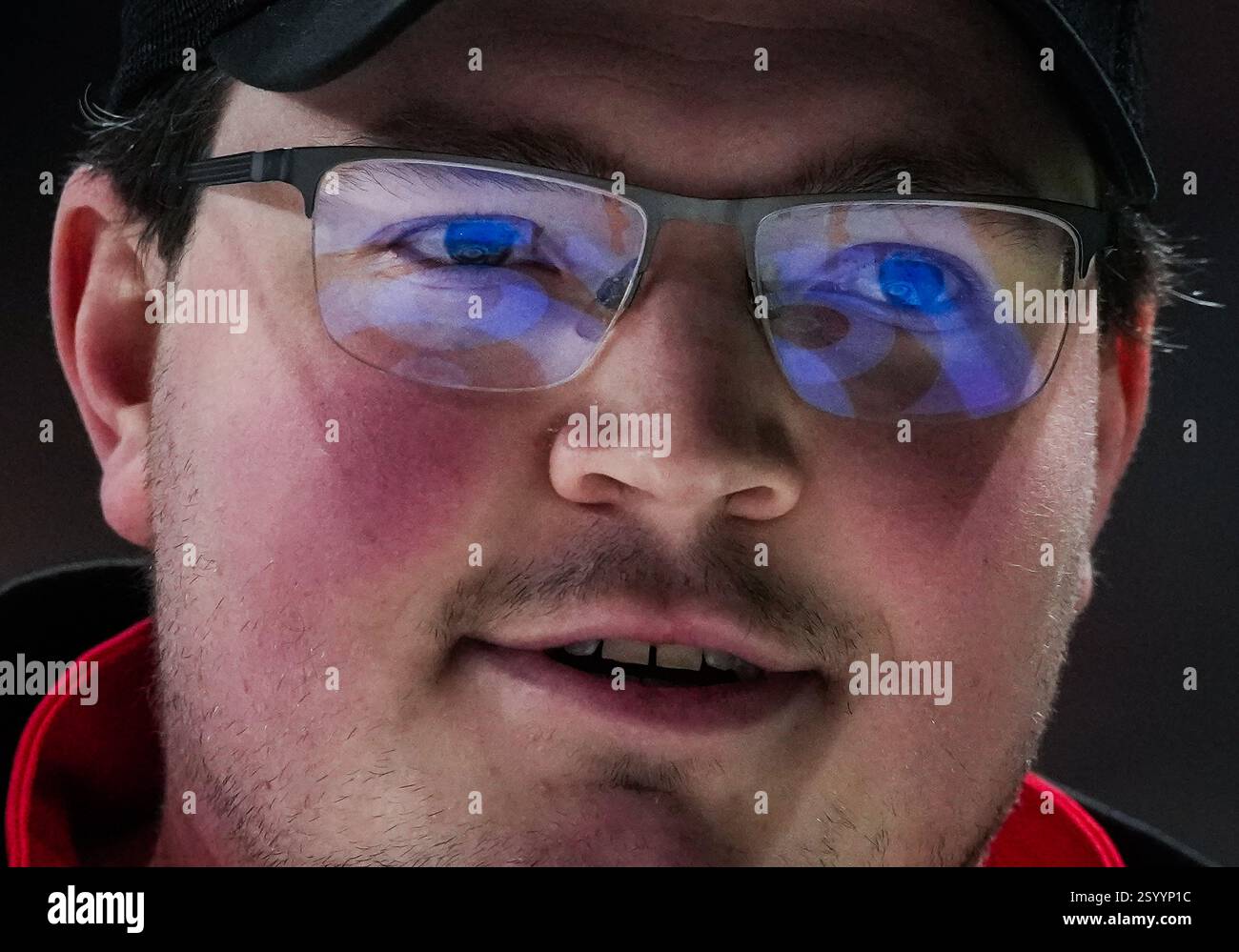 Kelowna, Canada. 01st Mar, 2025. Curling rings are reflected in the ...