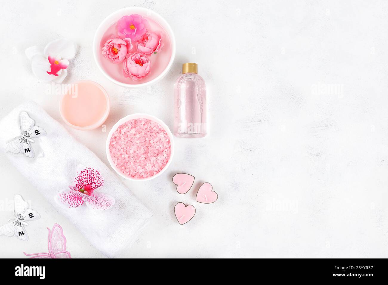 Spa and wellness composition with aromatic rose water, salt, roses and ...
