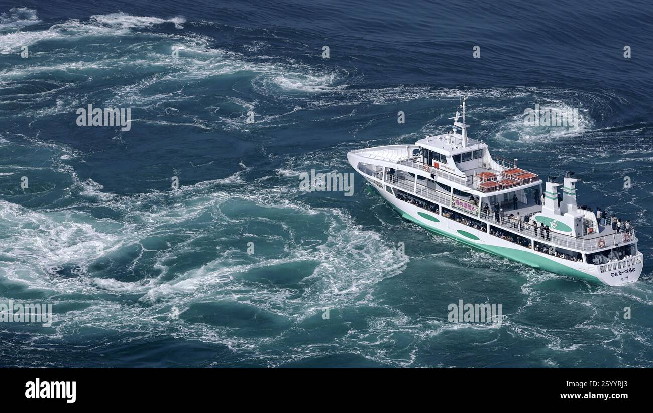 Photo taken from a Kyodo News helicopter shows a sightseeing boat ...