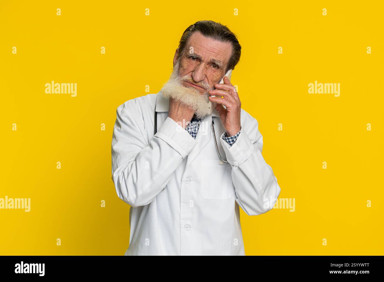 Disinterested senior doctor cardiologist man having annoyed boring talk ...