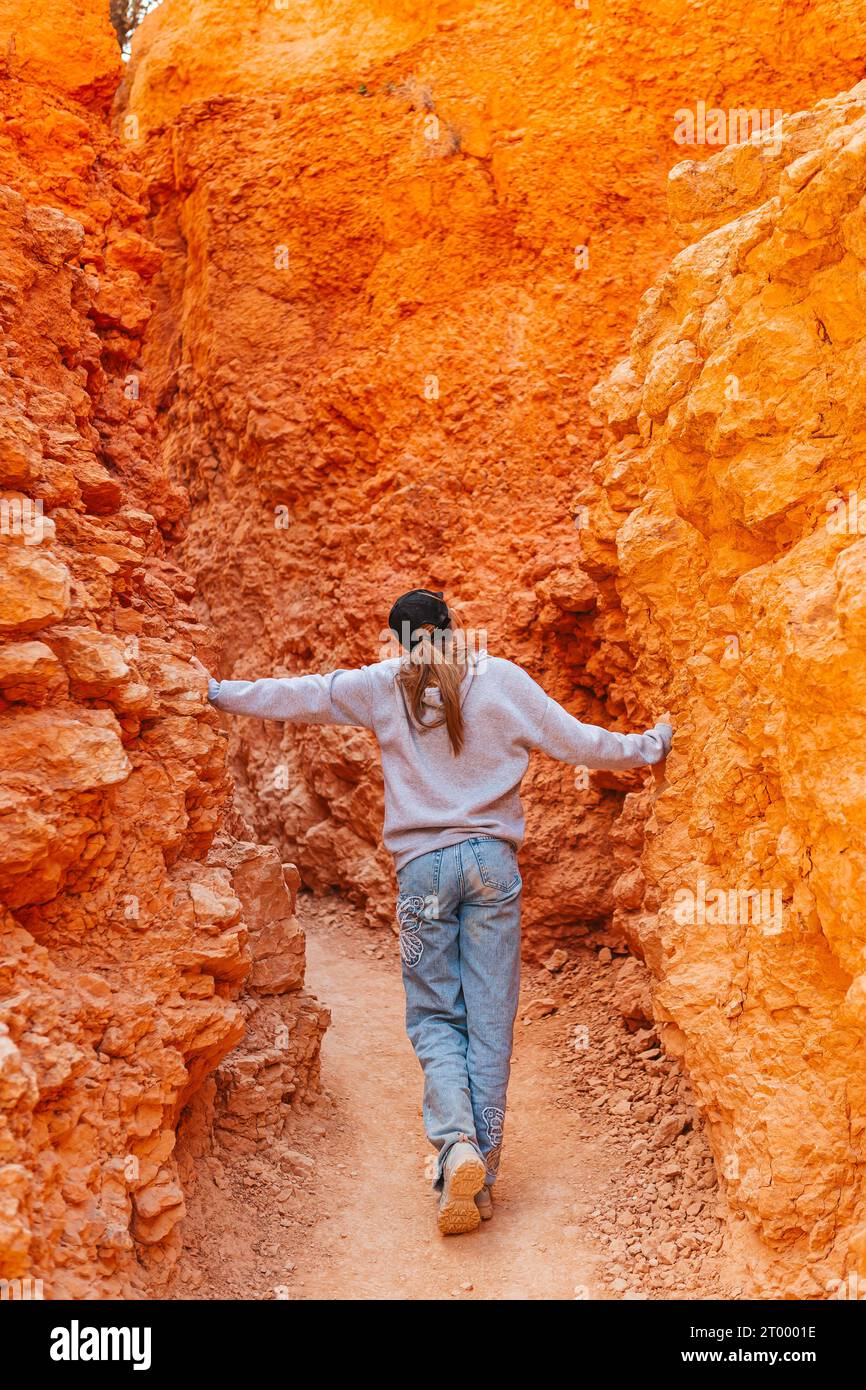 Hiker Girl In Bryce Canyon Hiking Relaxing Looking At Amazing View During Hike On Summer Travel