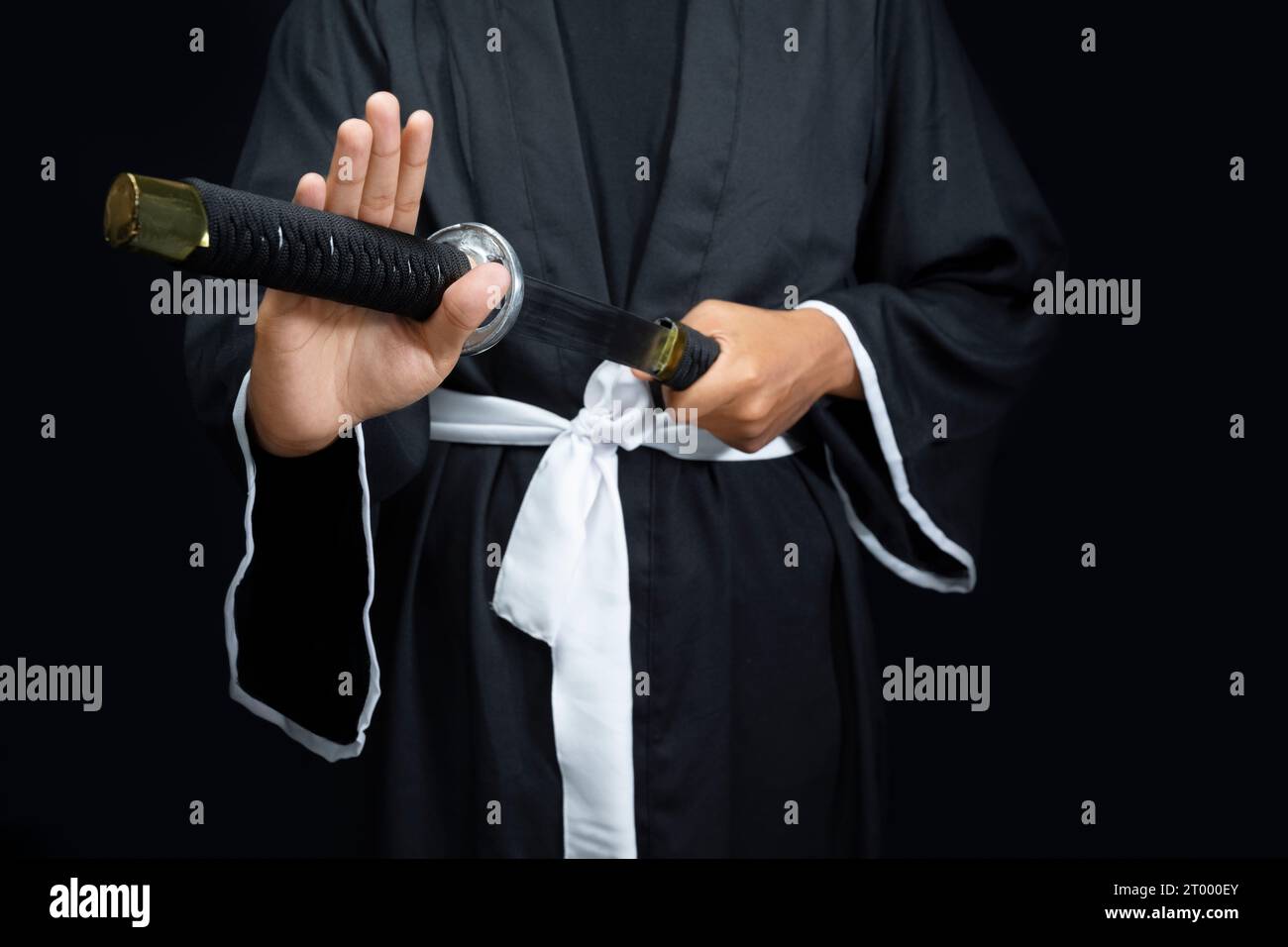 Samurai warrior gripping the sword with a black background Stock Photo ...