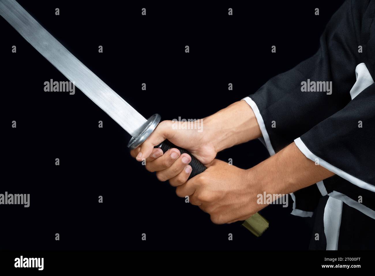 A Samurai warrior holding a sword with a black background Stock Photo ...