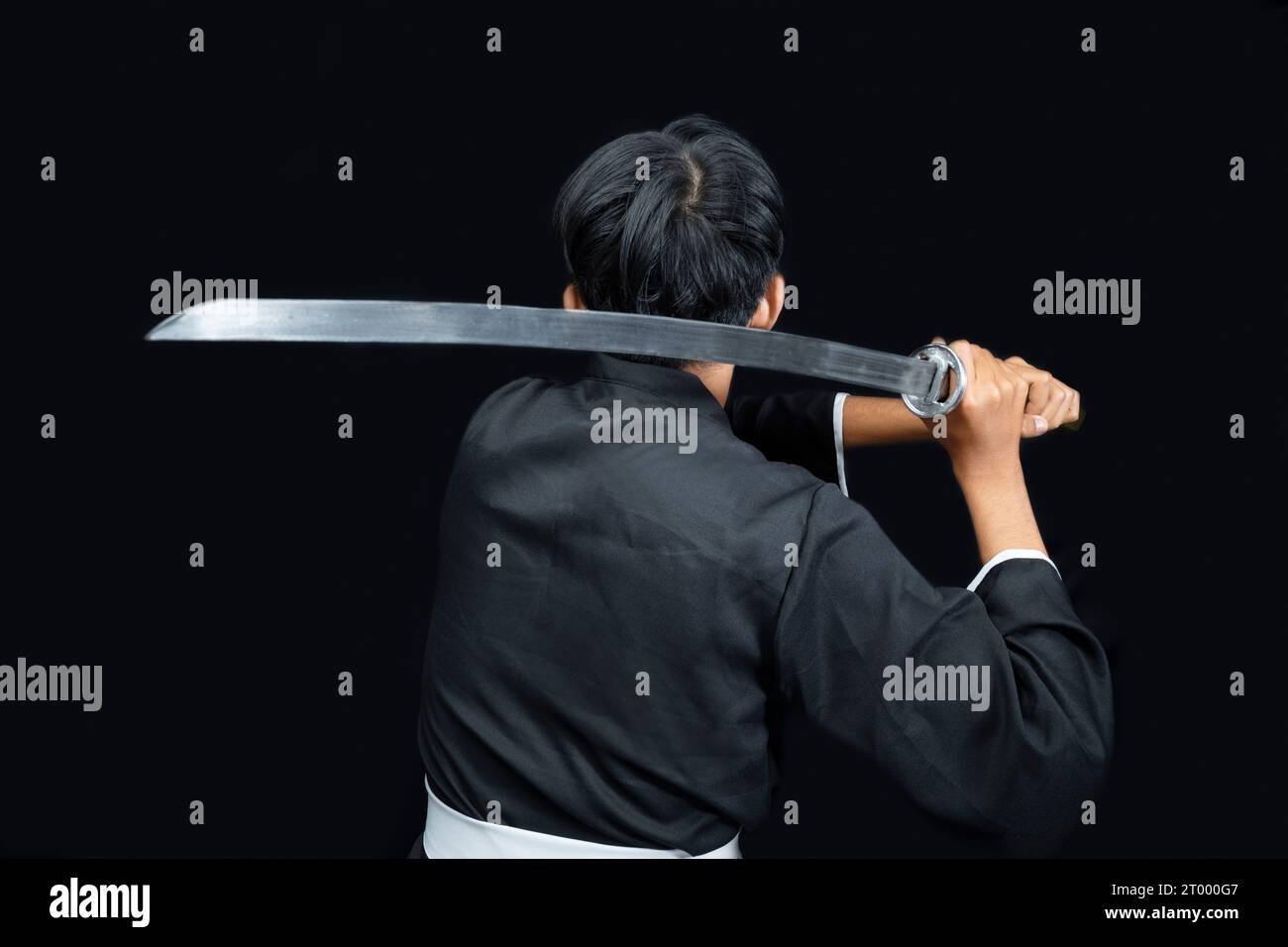 Rear view of a Samurai warrior holding the sword with a black ...