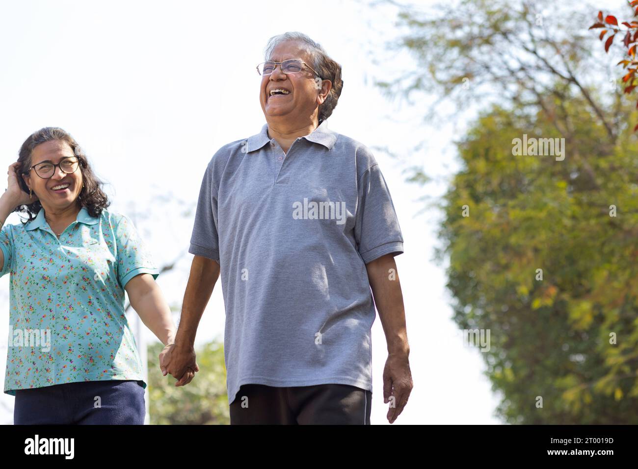 Asian senior couple walking in hi-res stock photography and images - Alamy