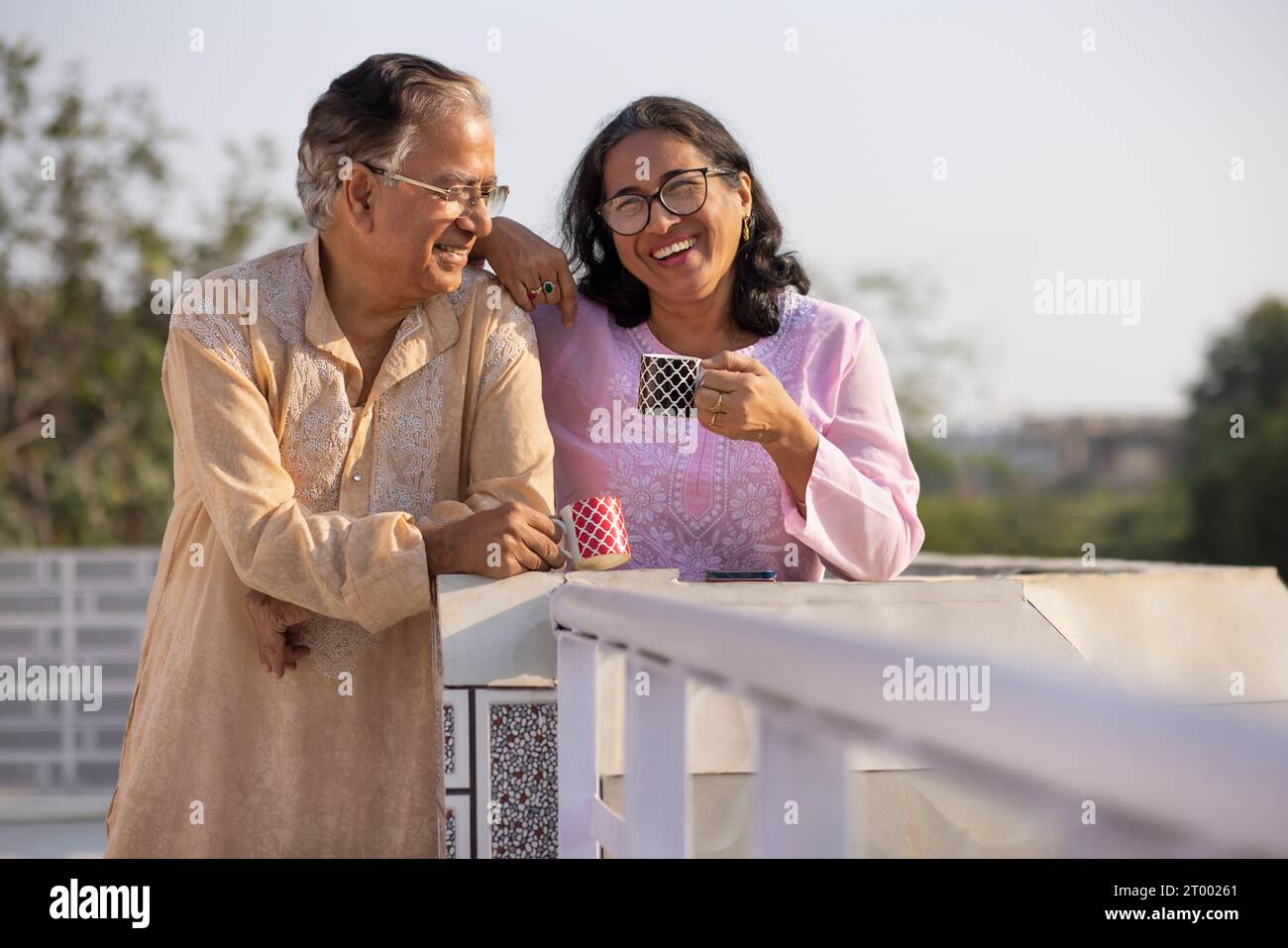 Happy Mature couple having tea together on rooftop Stock Photo - Alamy