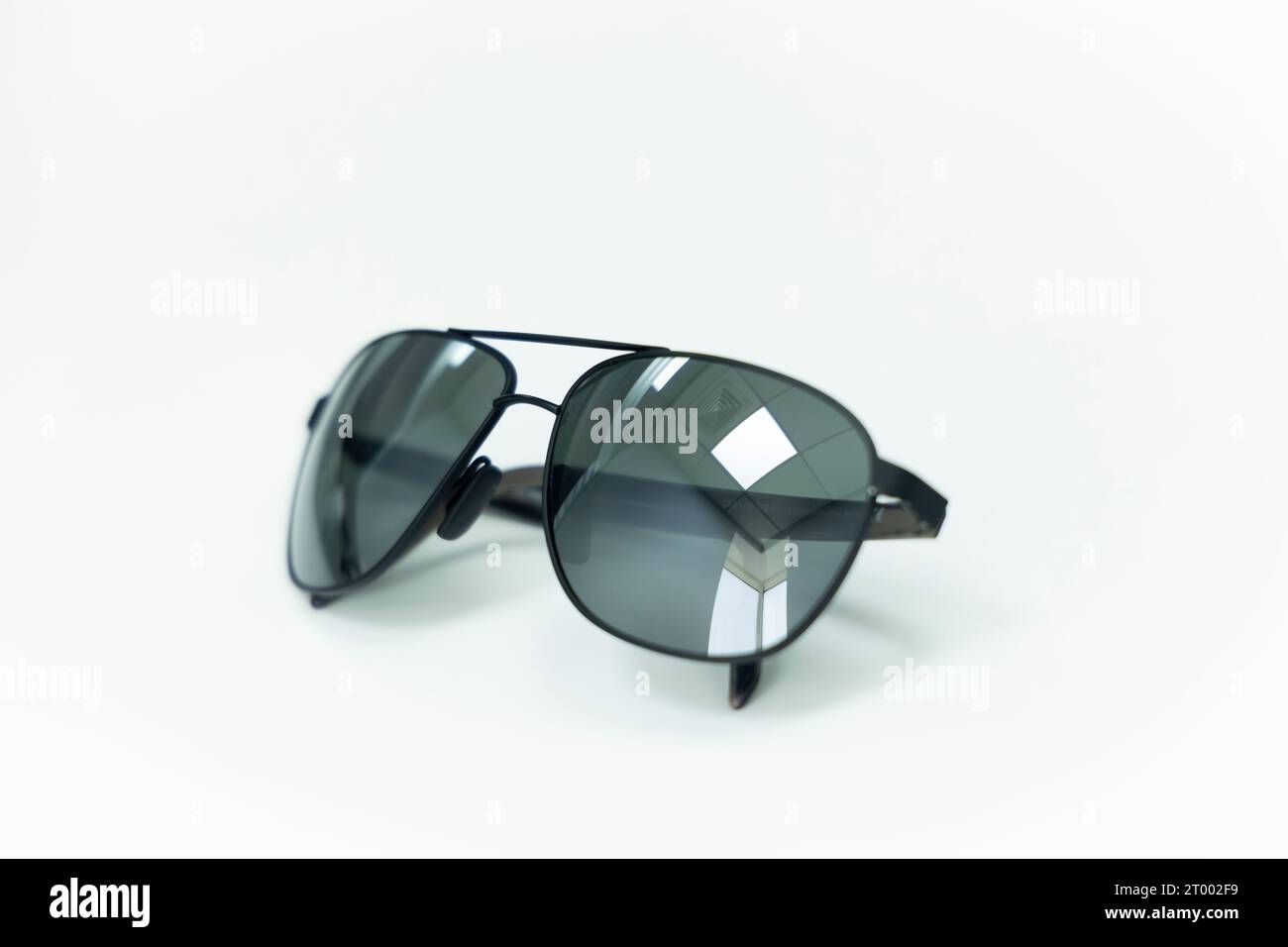 Table top view of a sunglass with white background Stock Photo - Alamy